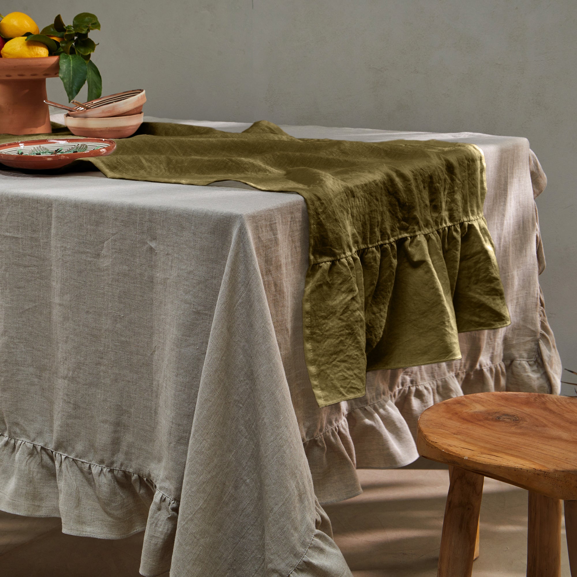 Ruffled linen table runner in green | Linenshed